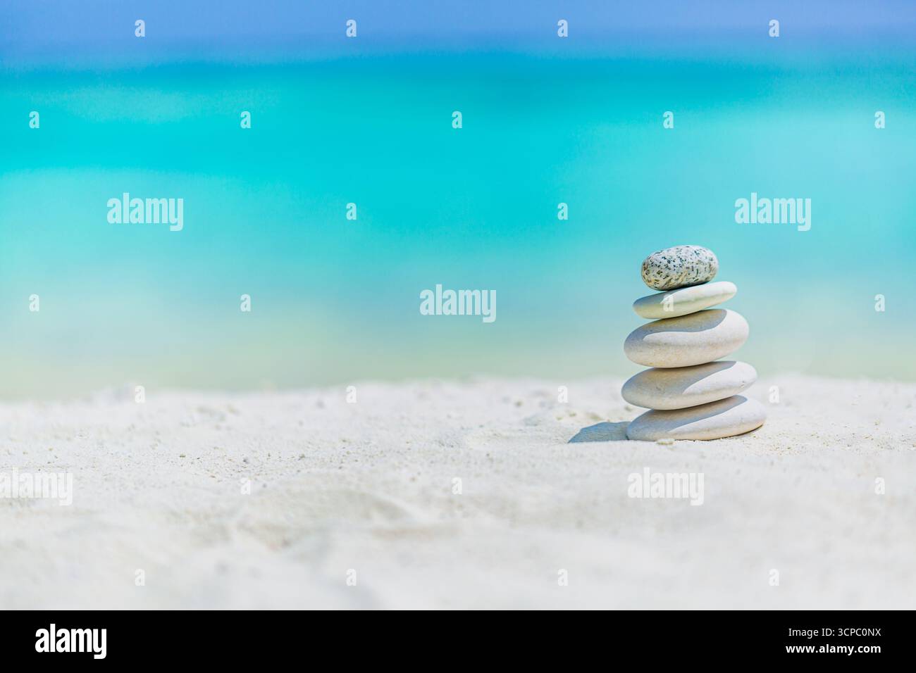 Gorgeous Zen stones in soft sand. Inspirational meditation beach with ...