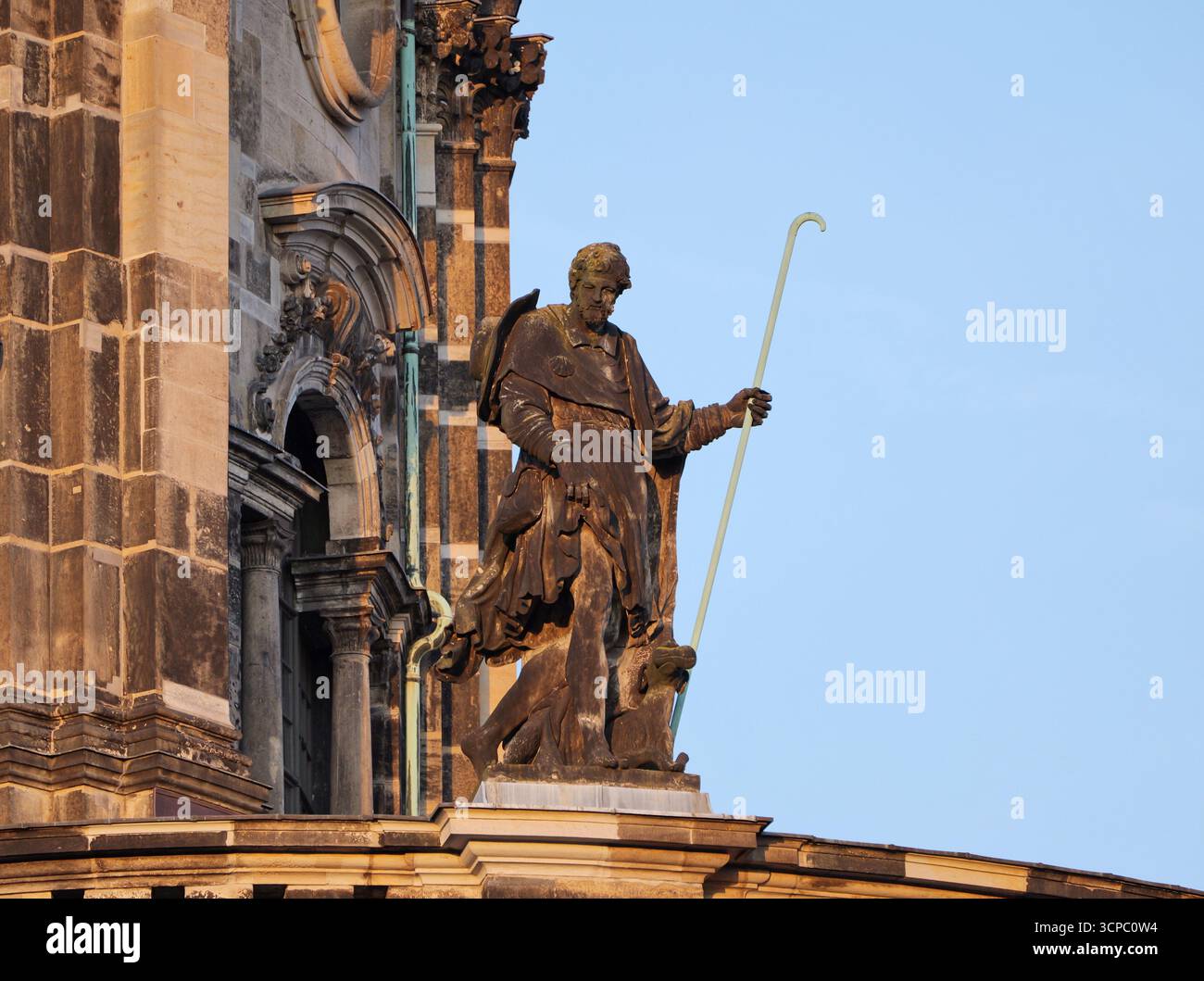 Stone statue with robe and staff on the Catholic Court Church in ...