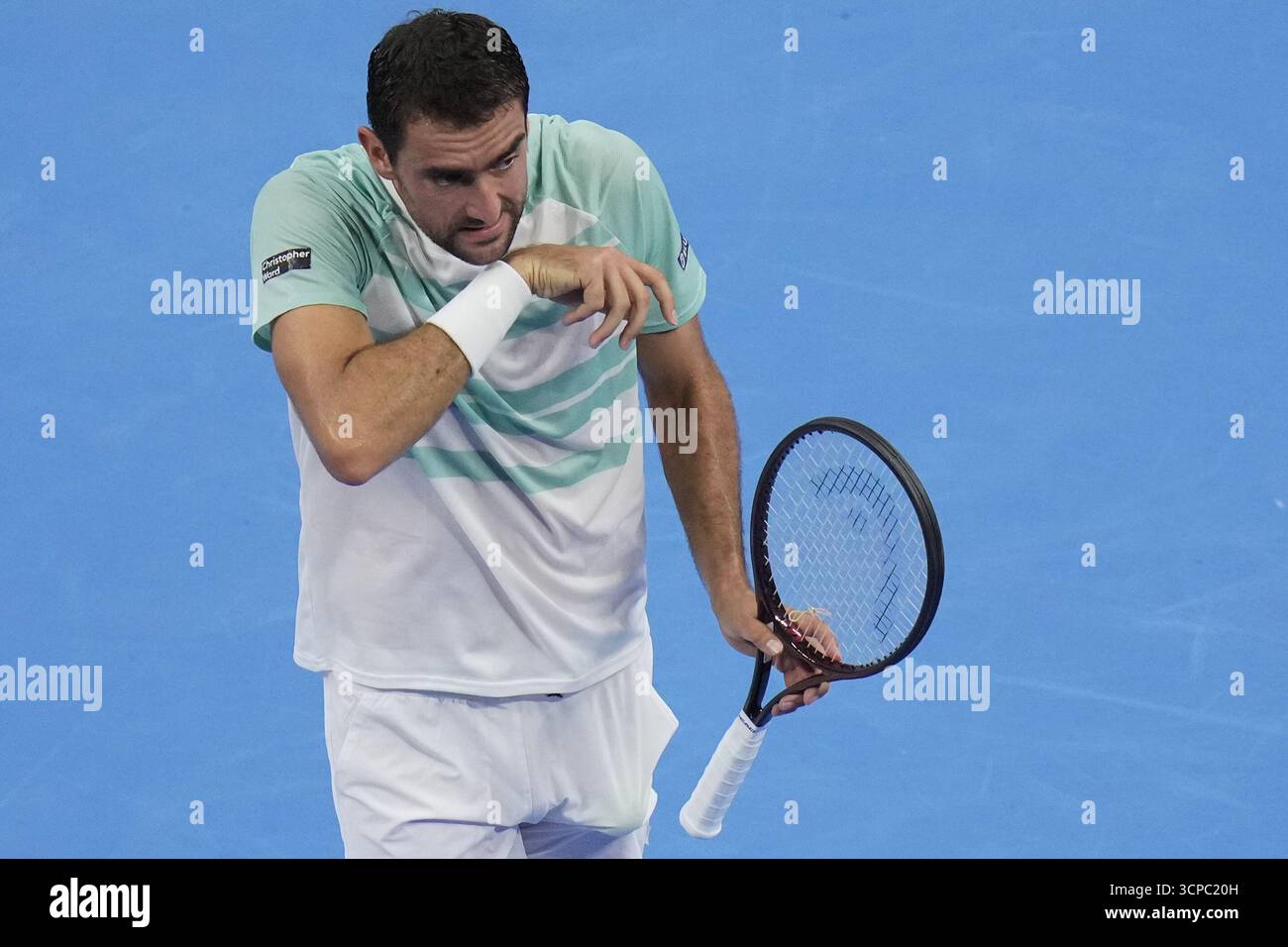 Marin Cilic, of Croatia reacts as he plays against Jannik Sinner, of Italy during the men's ...