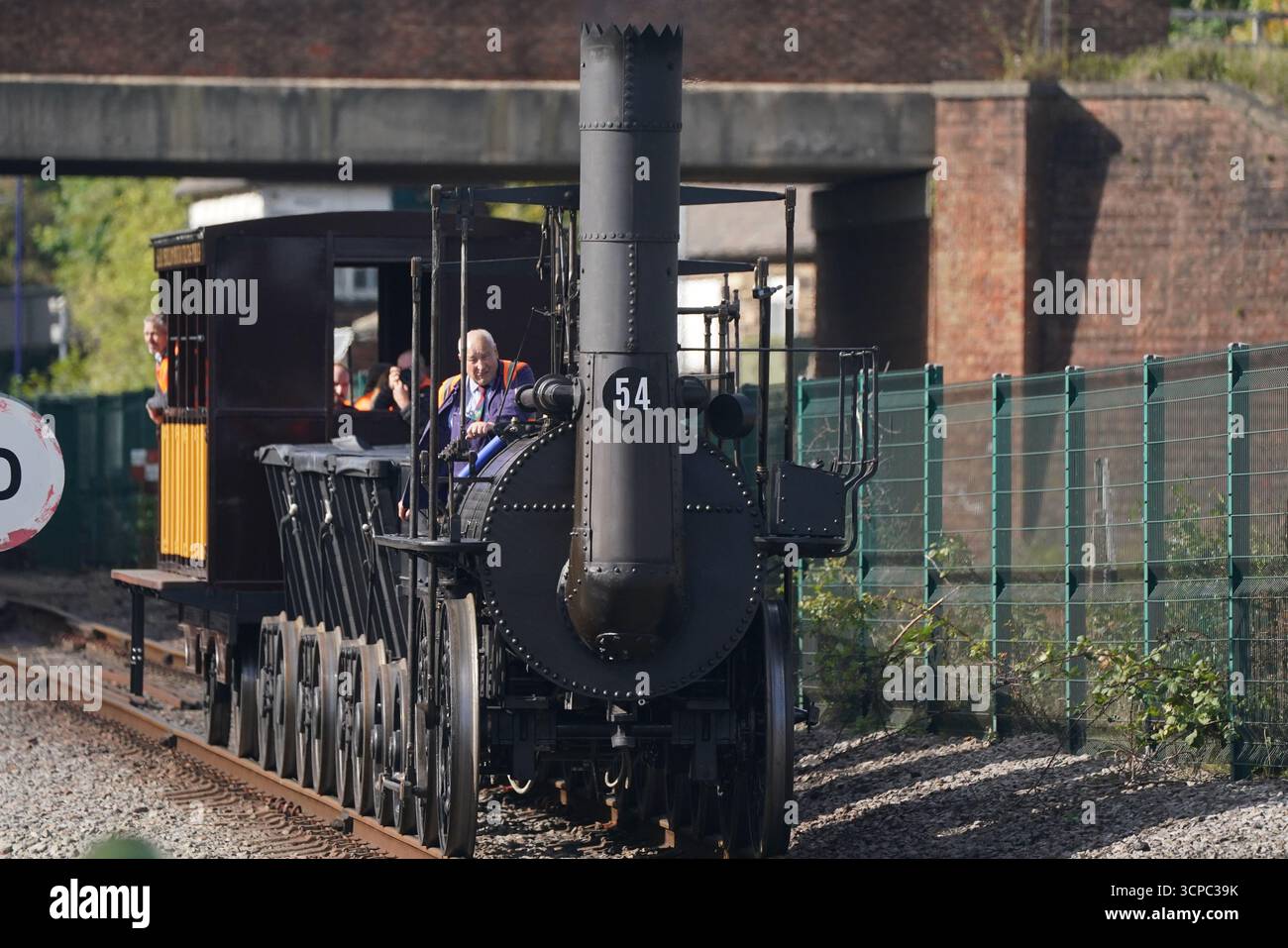 Train driver Chris Cubit rides on a replica of Locomotion No 1 during a ...