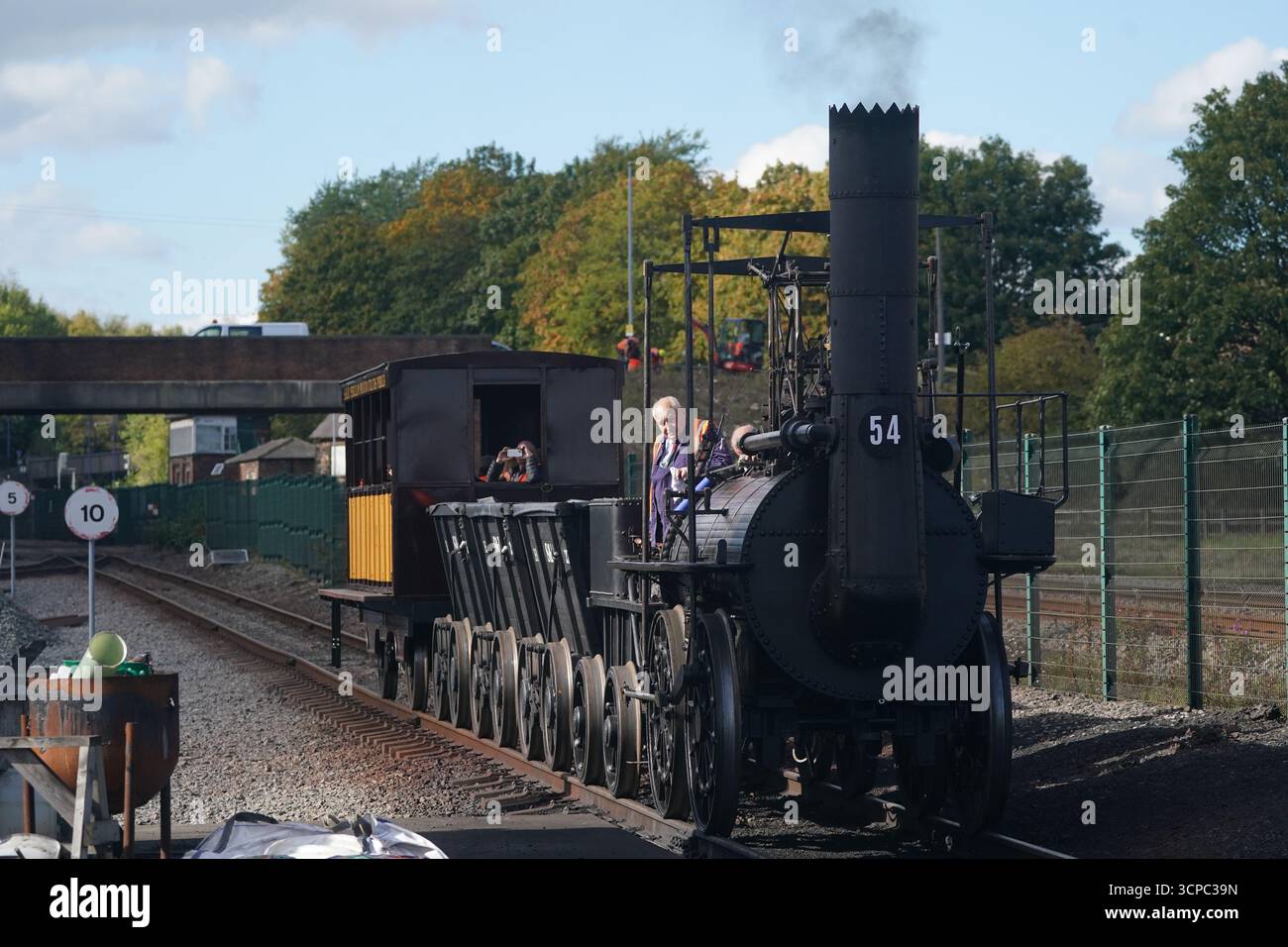 Train driver Chris Cubit rides on a replica of Locomotion No 1 during a ...