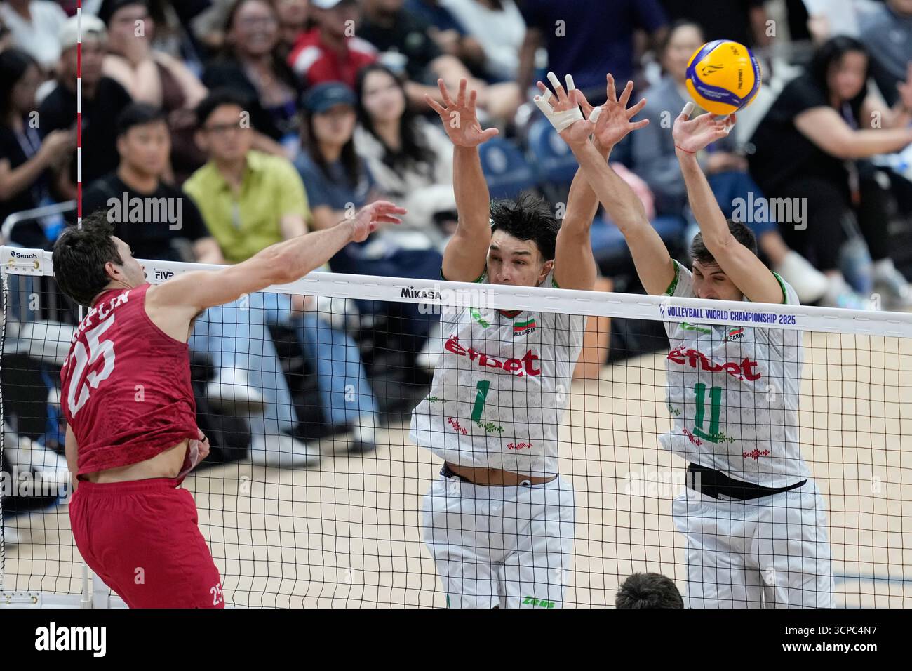 Aleks Grozdanov, right, and Simeon Nikolov of Bulgaria blocks a shot ...