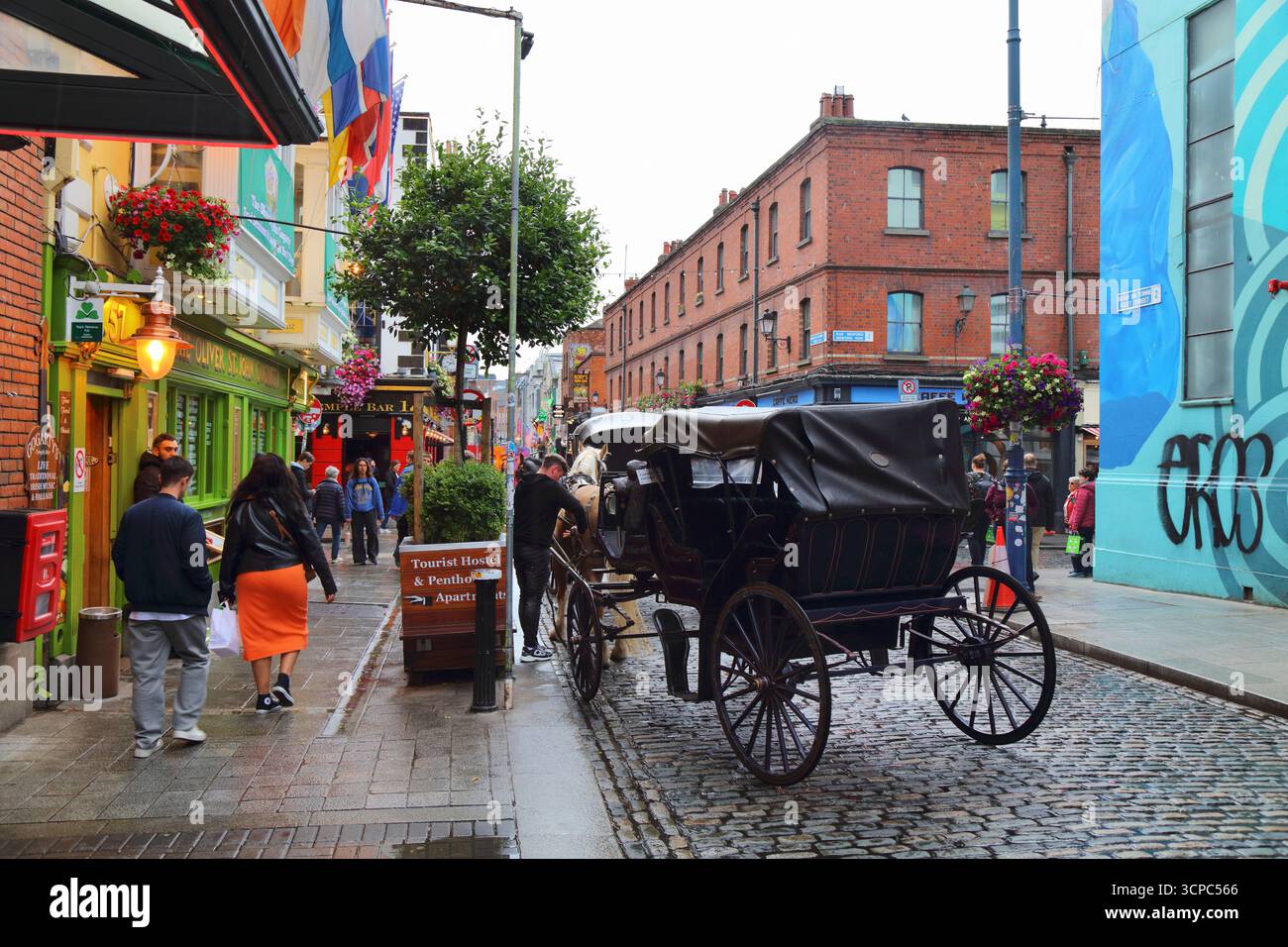 DUBLIN, IRELAND - JULY 5, 2024: People visit Temple Bar neighborhood ...