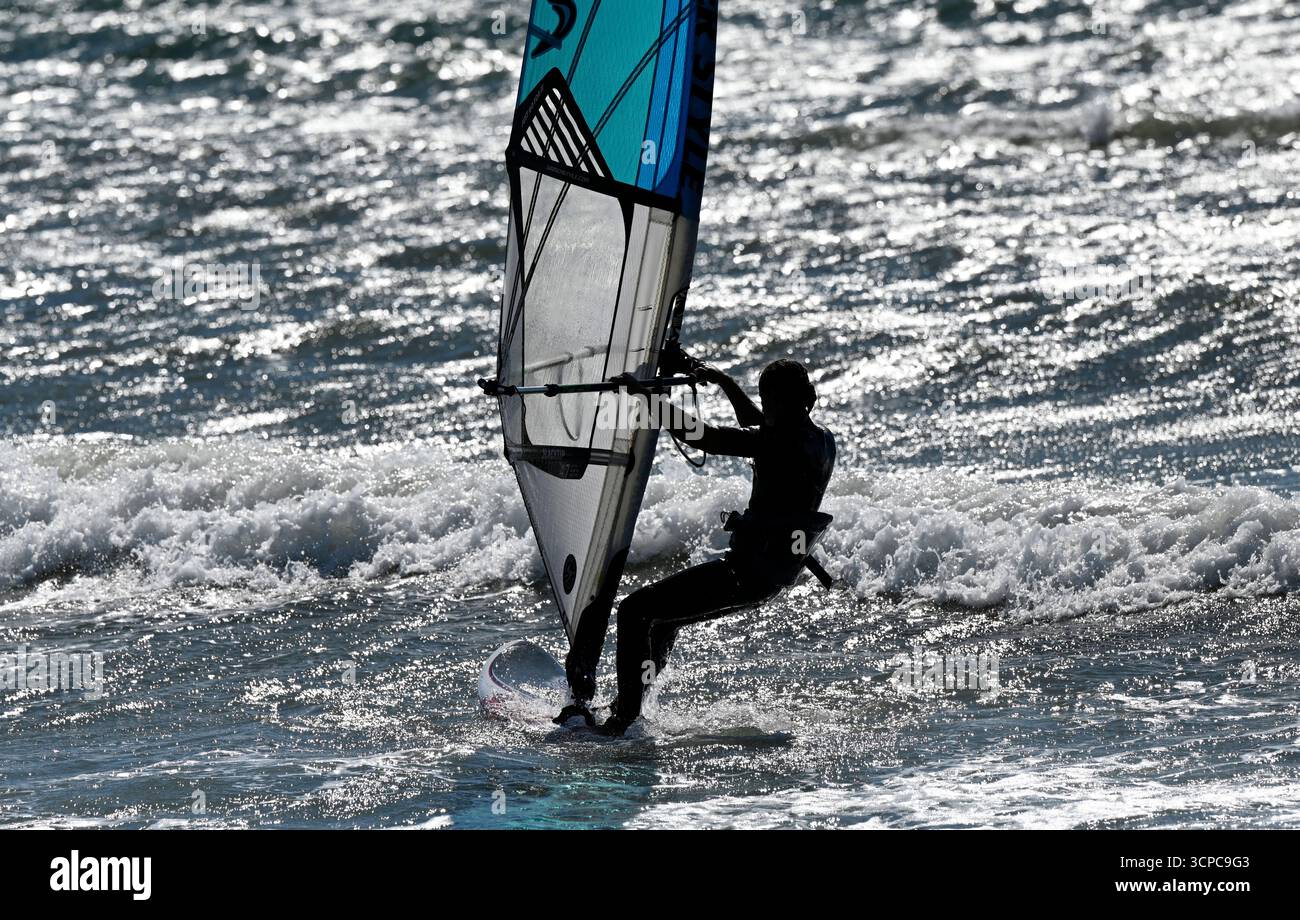 A windsurfer takes advantage of strong winds on September 25, 2025 in ...