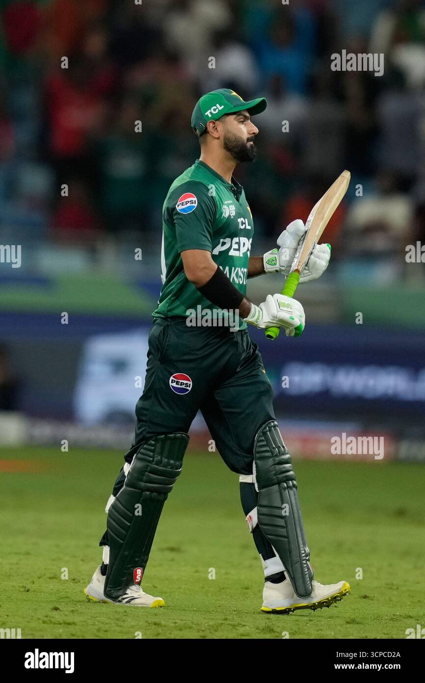 Pakistan's Hussain Talat walks off the field after losing his wicket ...