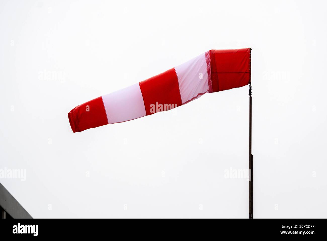 Bavaria, Germany - September 25, 2025: A red and white windsock ...