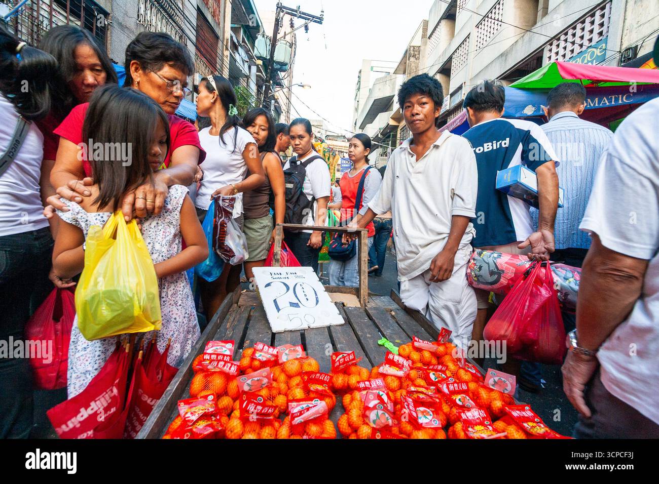 A busy and crowded street market scene during the Christmas holiday ...