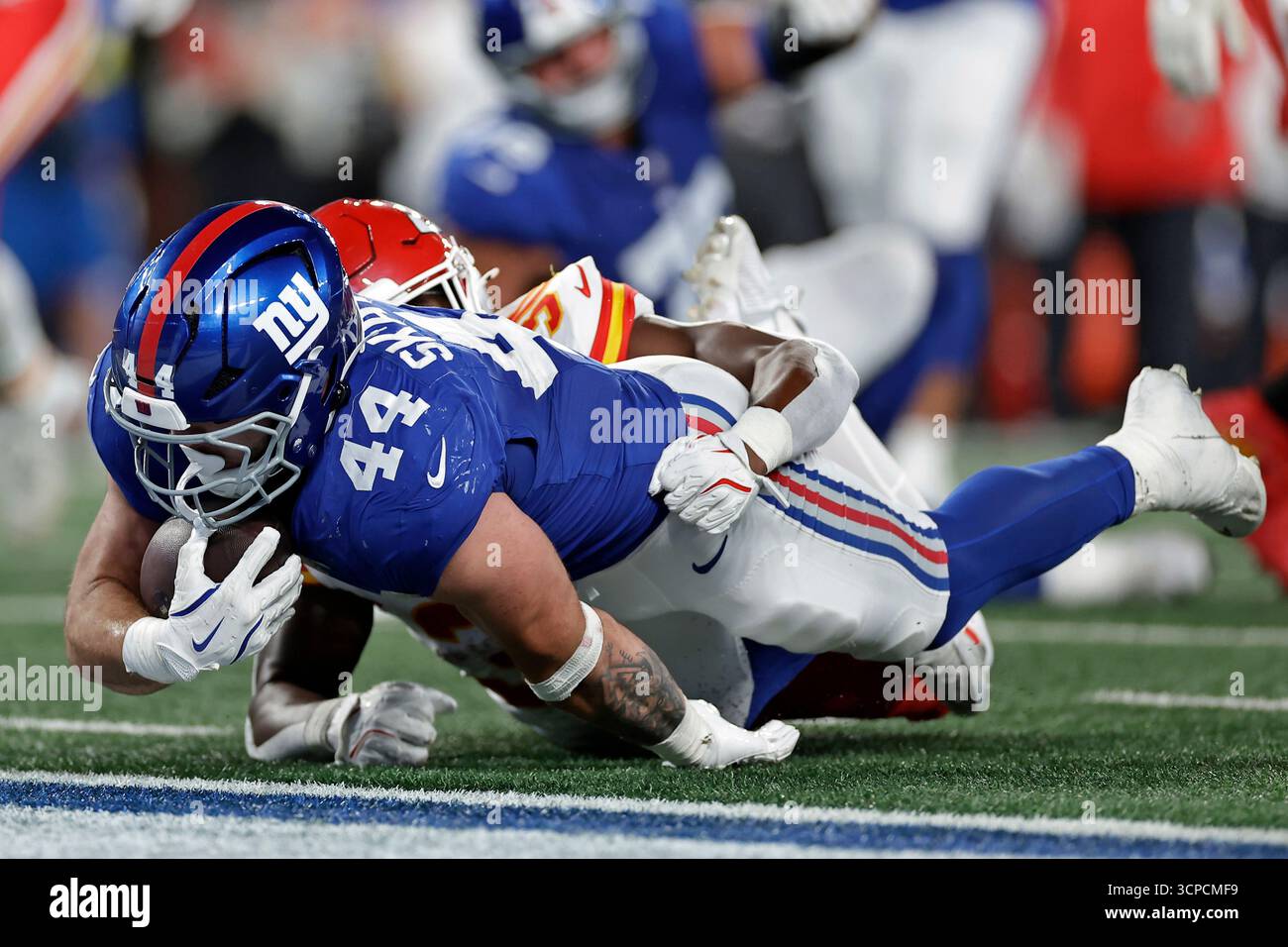 New York Giants running back Cam Skattebo (44) dives for a touchdown ...