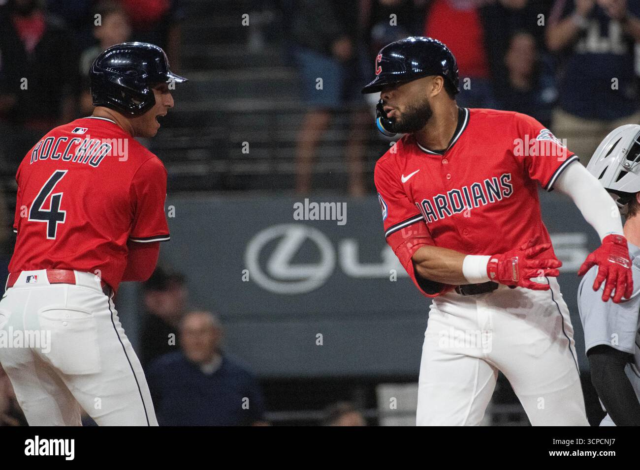 Cleveland Guardians' Brayan Rocchio, left, congratulates George Valera ...