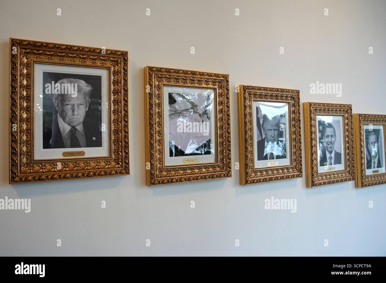Framed images of President Donald Trump and former President Joe Biden ...