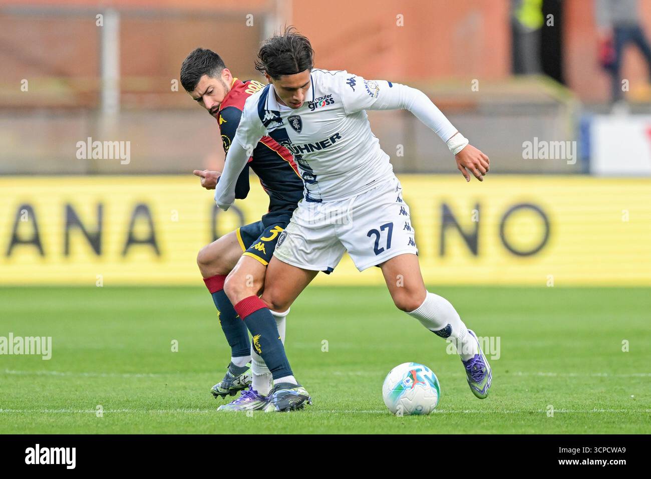 GenoaÕs Aaron Martin fights for the ball with EmpoliÕs Brando Moruzzi ...