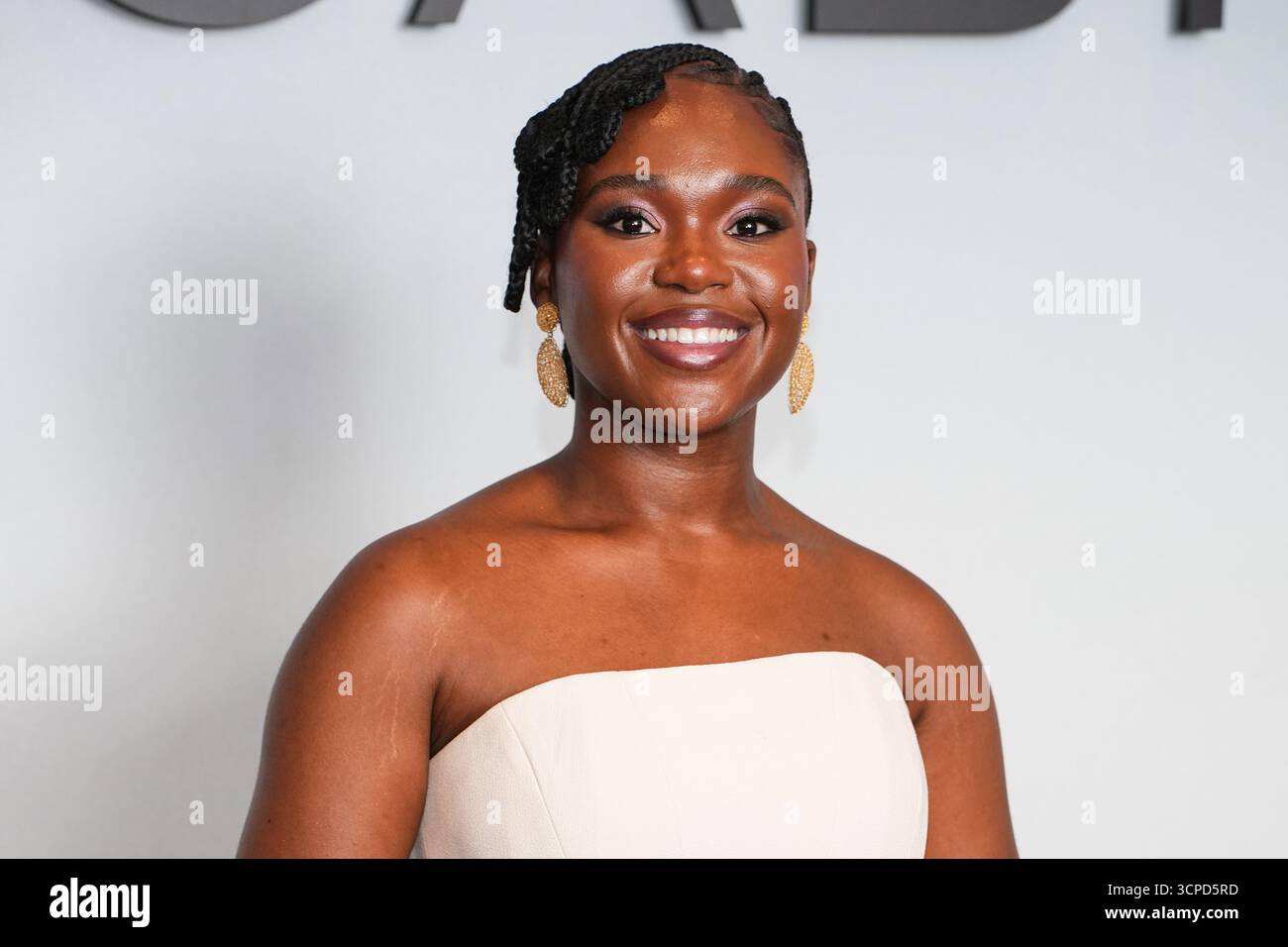 Ayo Owoyemi-Peters poses for photographers upon arrival at the premiere ...