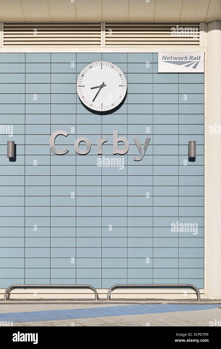 Clock on a wall of the ticket office at the rail station in Corby ...