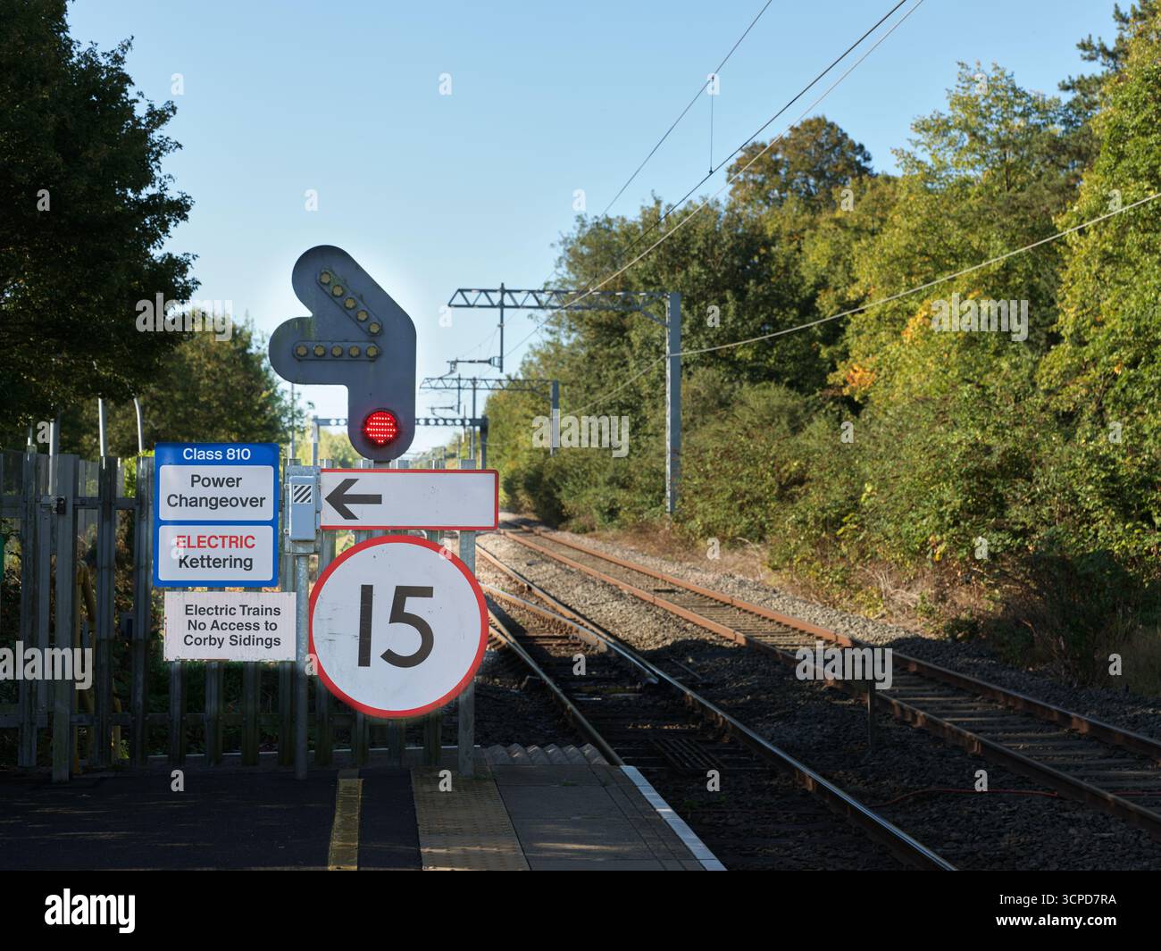 Speed limit sign of 15 mph on the railway track by the rail station at ...