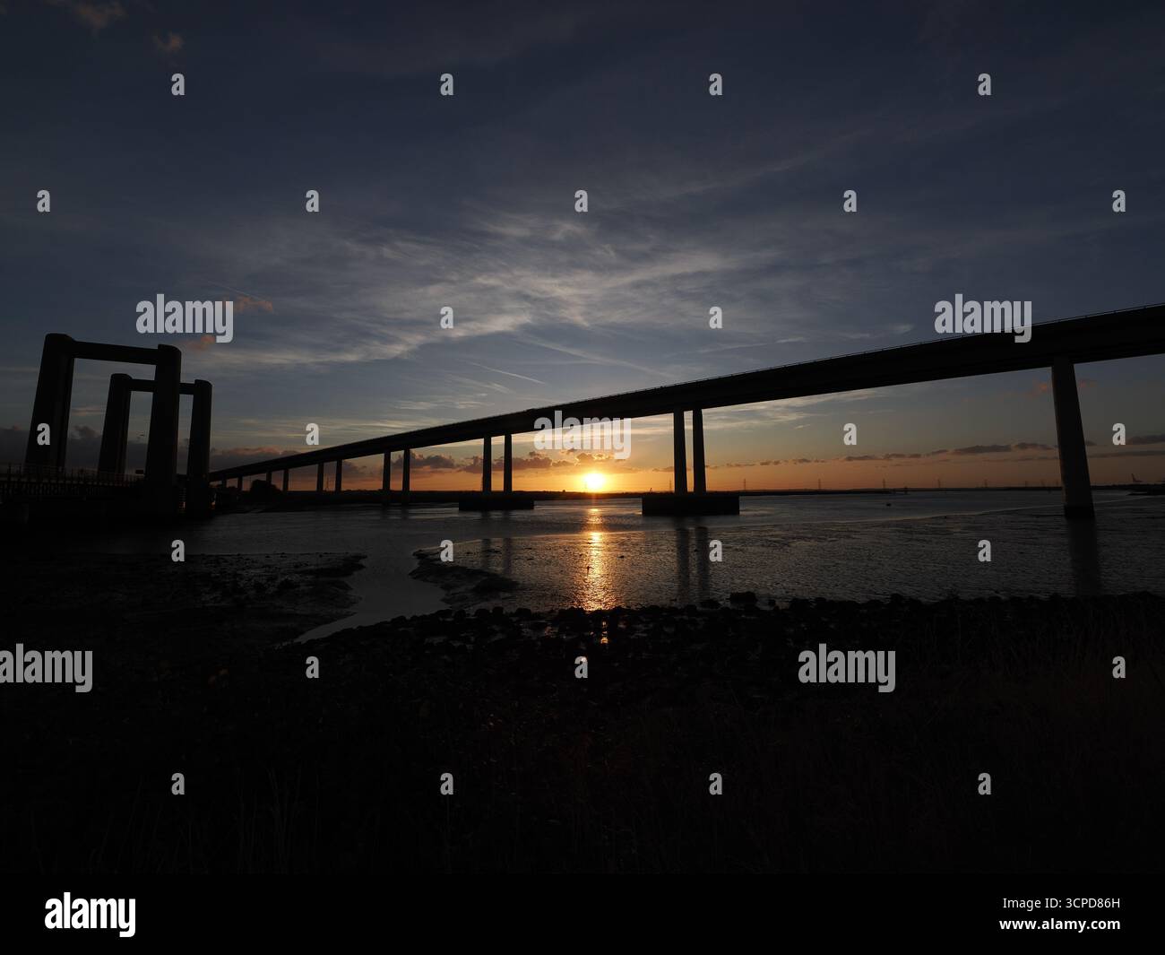 Sheerness, Kent, UK. 25th Sep, 2025. UK Weather: sunset through the ...