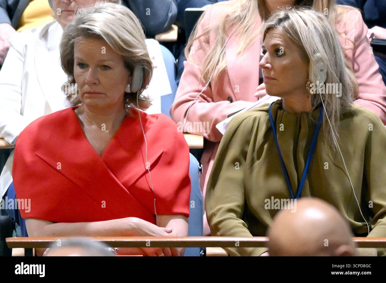 Queen Mathilde of Belgium and Queen Maxima of the Netherlands listen as ...