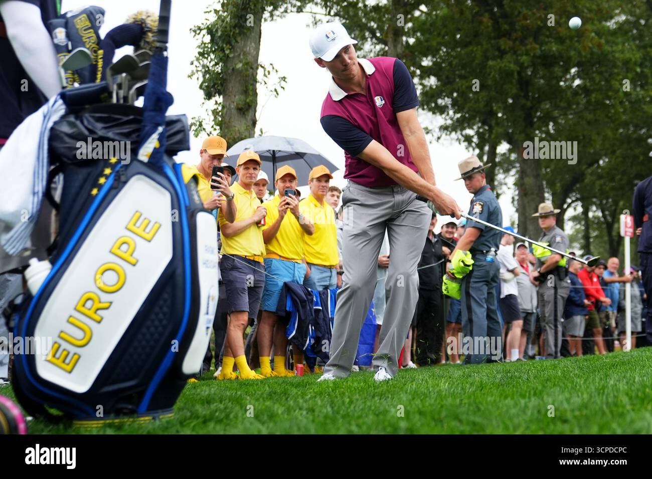 Europe's Rasmus Højgaard chips to the green during a practice round at ...