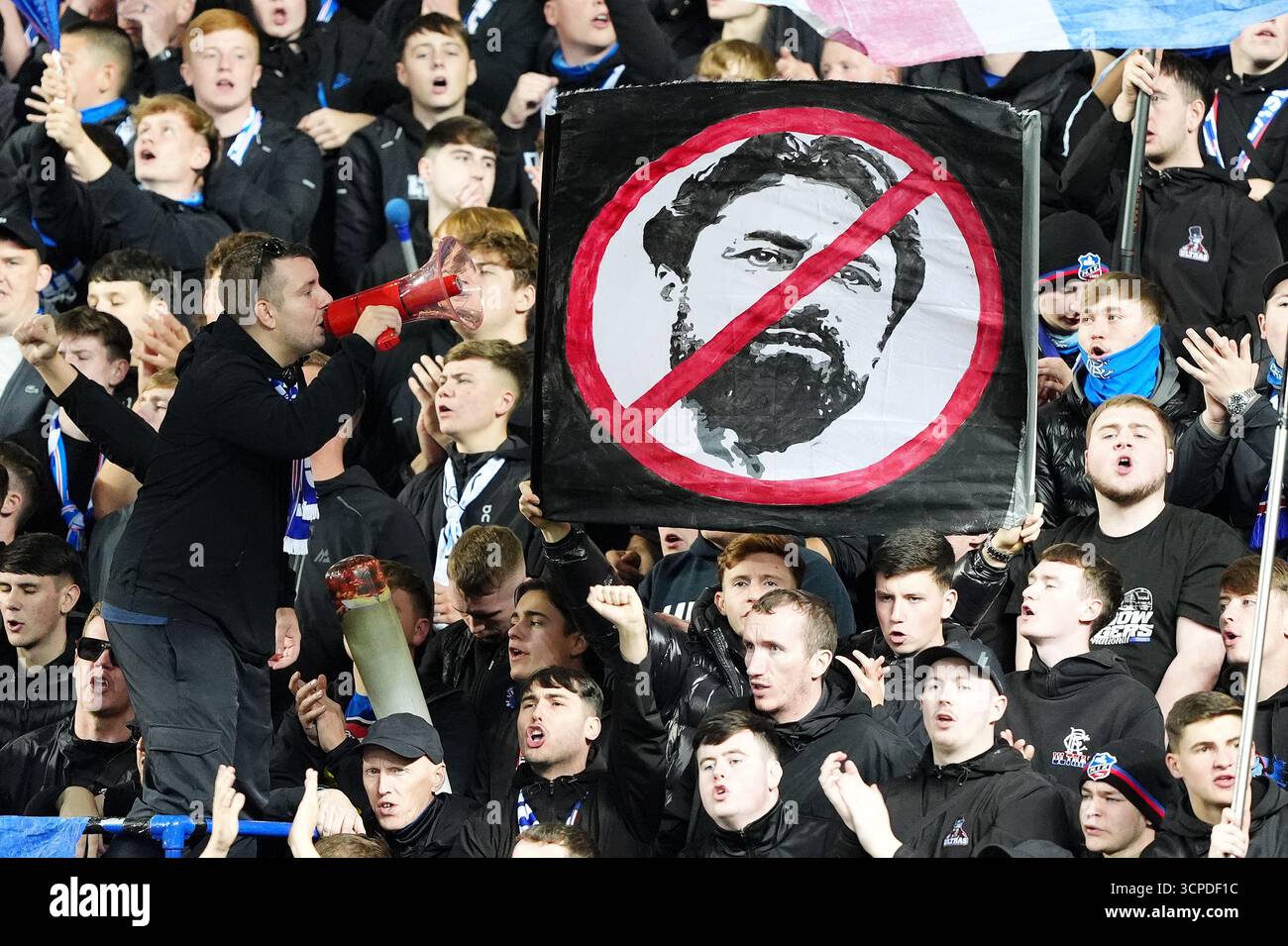 Rangers fans protest with signs in the stands against manager Russell ...