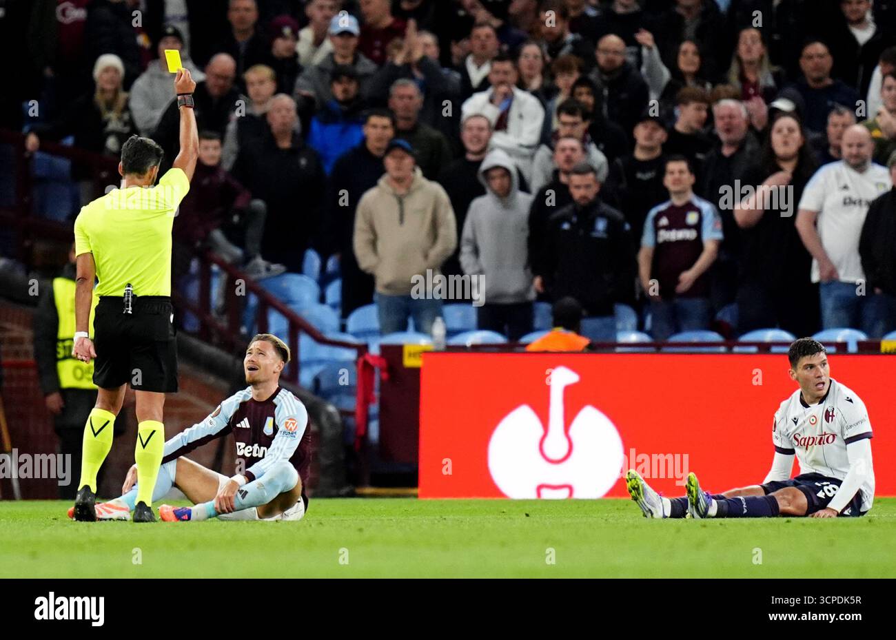 Aston Villa's Matty Cash is shown a yellow card for a foul on Bologna's ...