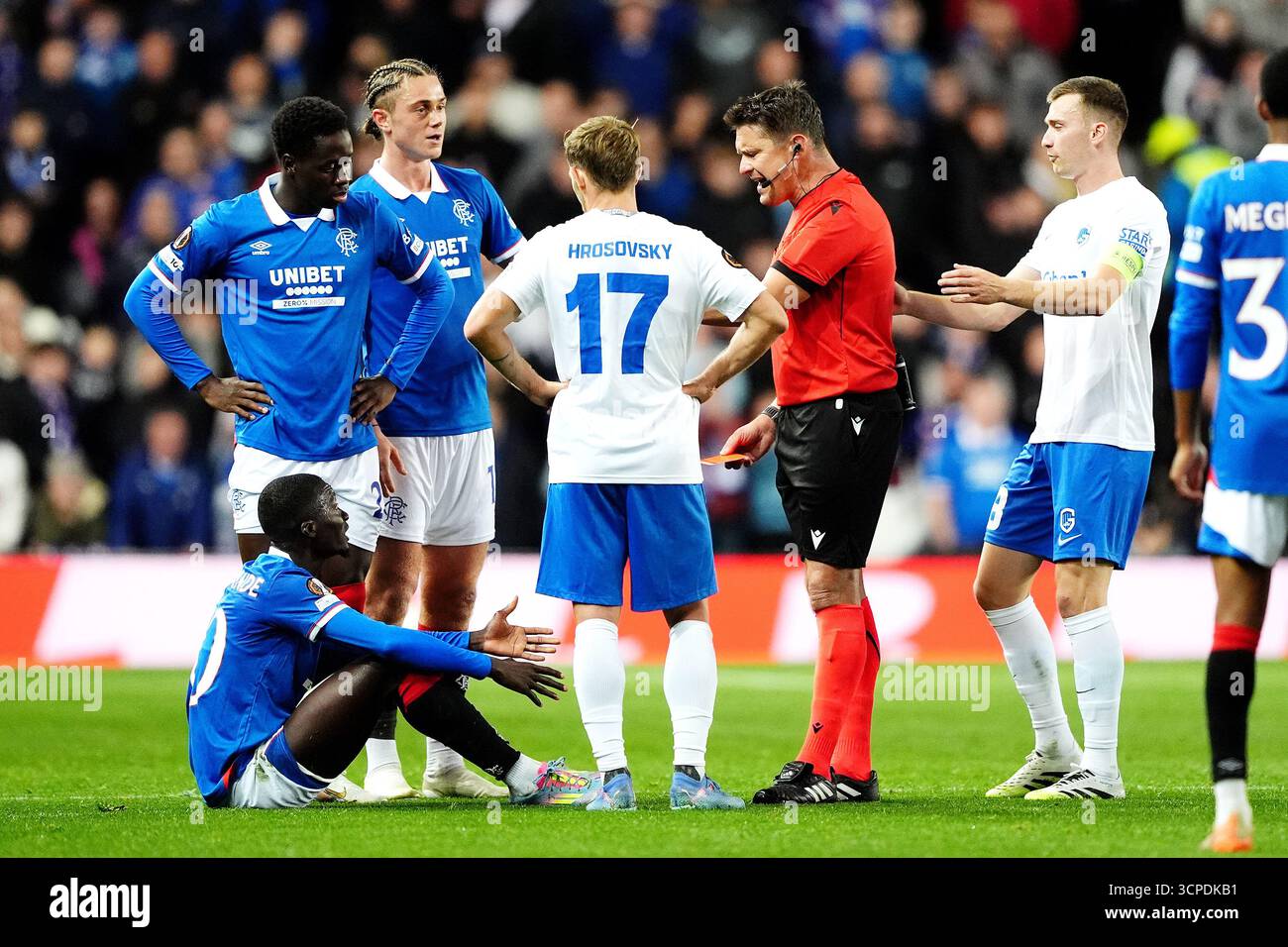 Rangers' Mohammed Diomande (left) is shown a red card by referee Matej ...