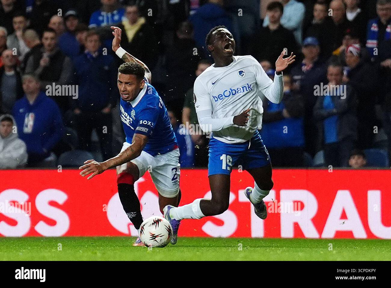 Rangers' James Tavernier (left) tackles Genk's Yaimar Medina in the ...