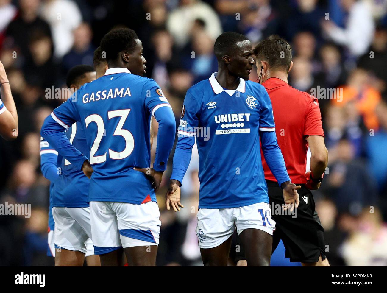 Rangers' Mohammed Diomande (front right) reacts after being shown a red ...