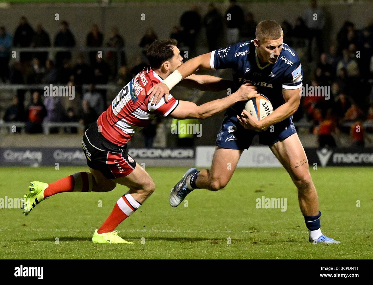 Sale Sharks' Rob du Preez (right) is tackled by Gloucester's Ben Loader ...