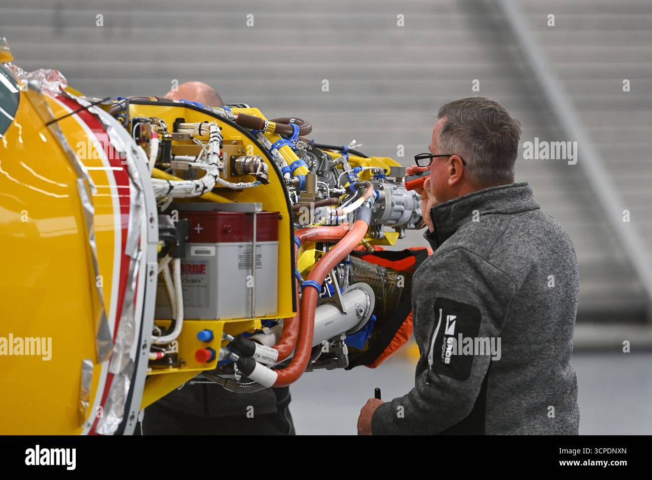 Aircraft construction, skilled worker, aircraft mechanic during testing ...