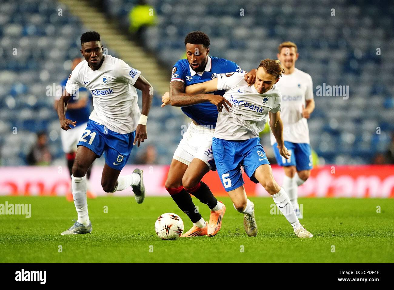 Rangers' Youssef Chermiti (centre) and Genk's Matte Smets battle for ...