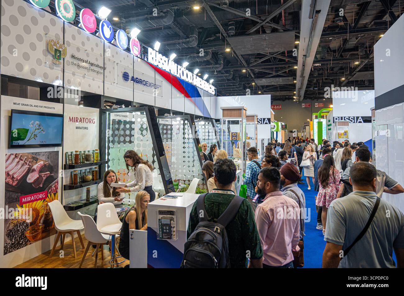 View of a crowded Russian food pavilion, where people gather to see ...