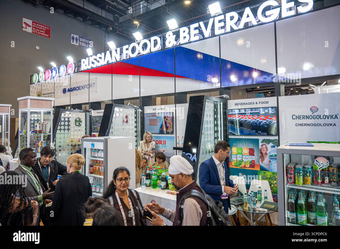 View of a crowded Russian food pavilion, where people gather to see Russian packaged food ...