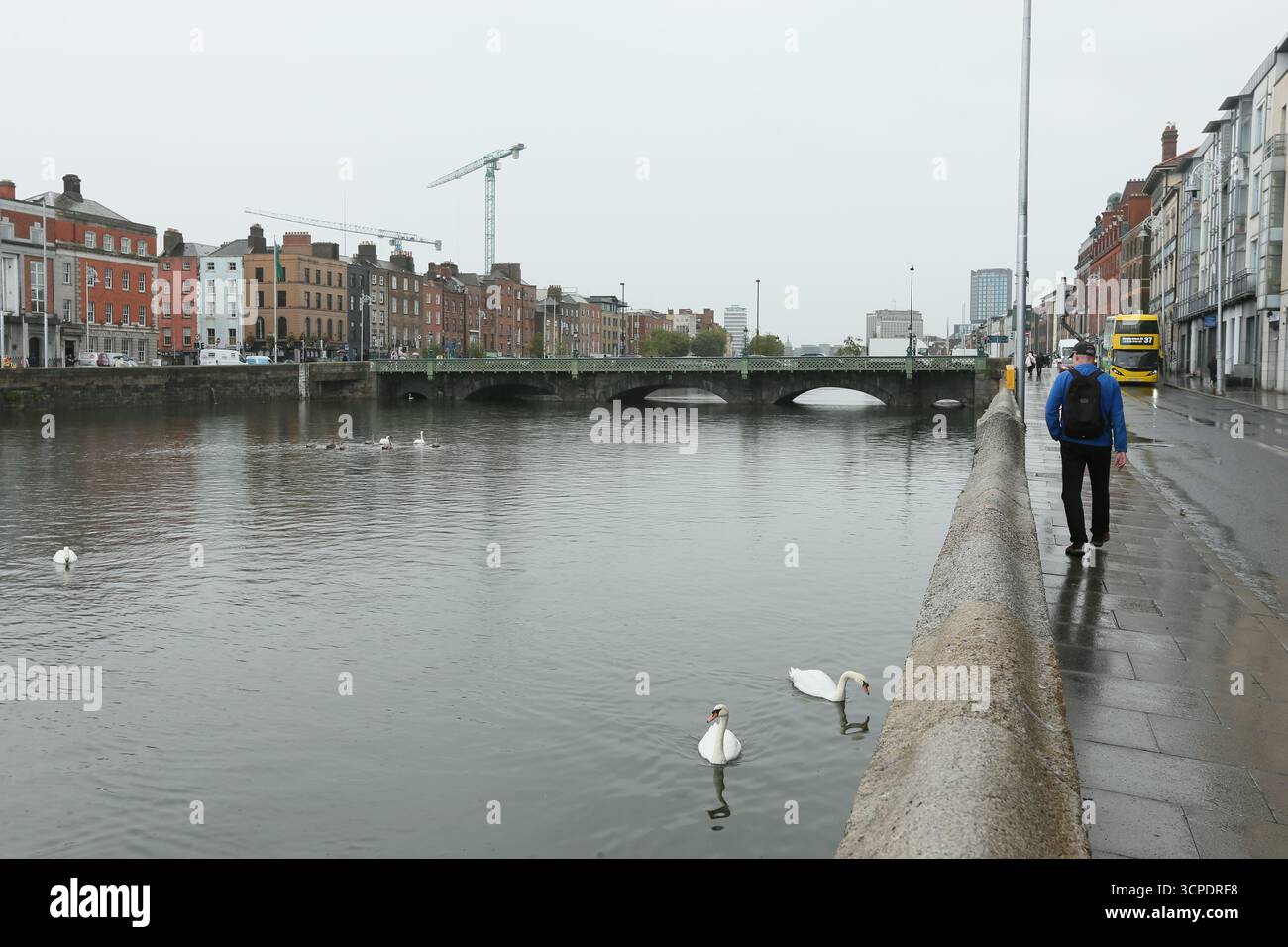 Dublin, Ireland - 10th September 2025 - A man walks along the footpath ...