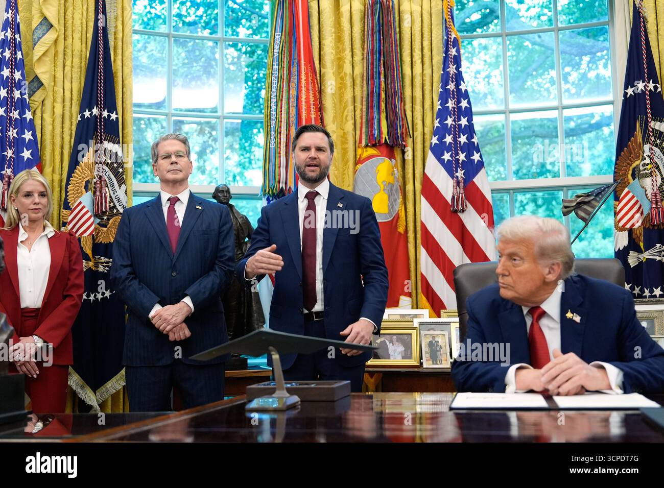 President Donald Trump listens as Vice President JD Vance speaks to ...