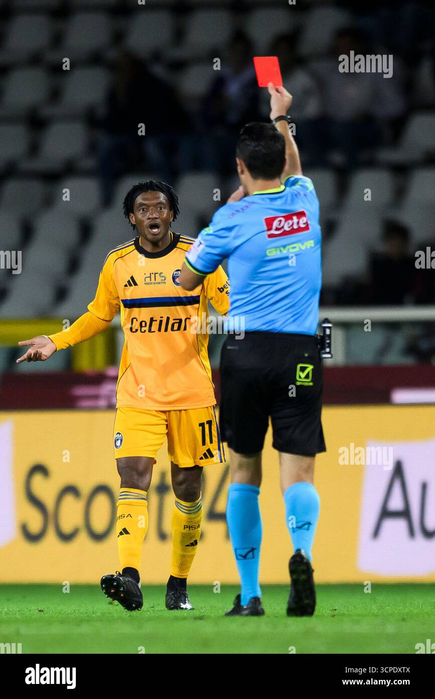 Juan Cuadrado of Pisa SC is shown a red card by referee Ivano Pezzuto ...