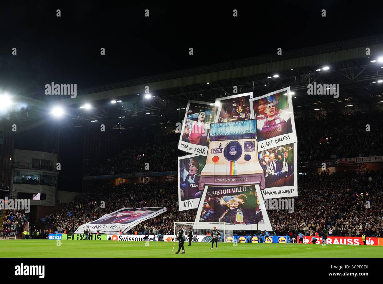 Aston Villa fans holding up banners in The Holte End stand before the ...