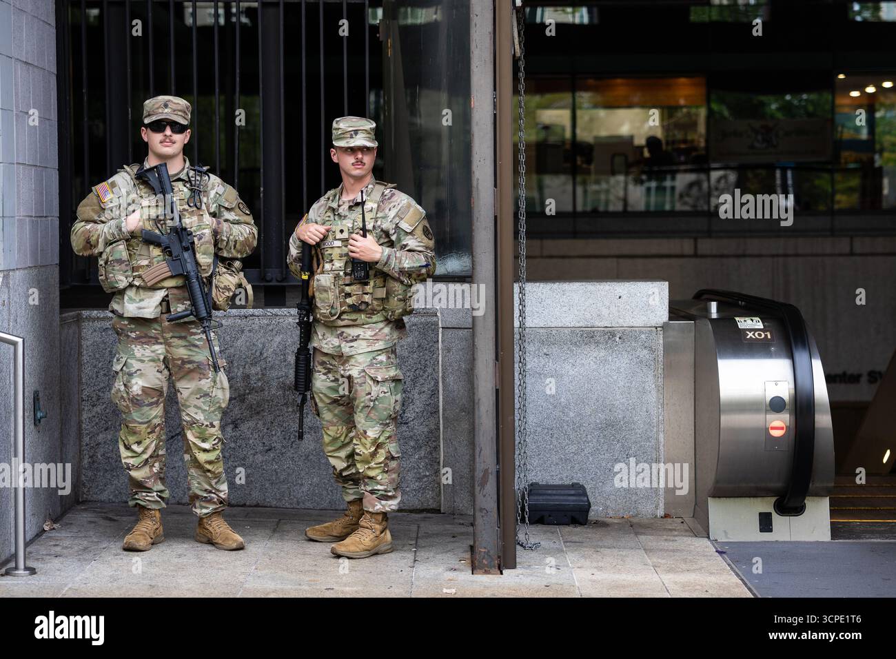 Armed National Guard members are seen outside the Federal Center SW ...