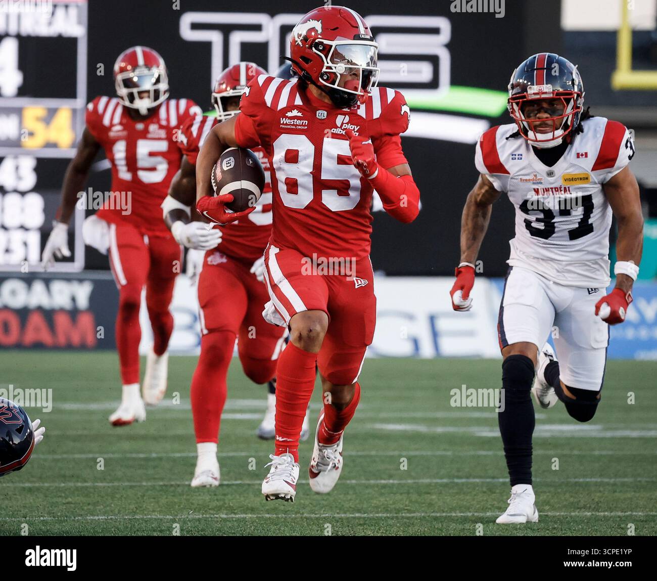 Montreal Alouettes' Wesley Sutton, right, gives chase to Calgary ...