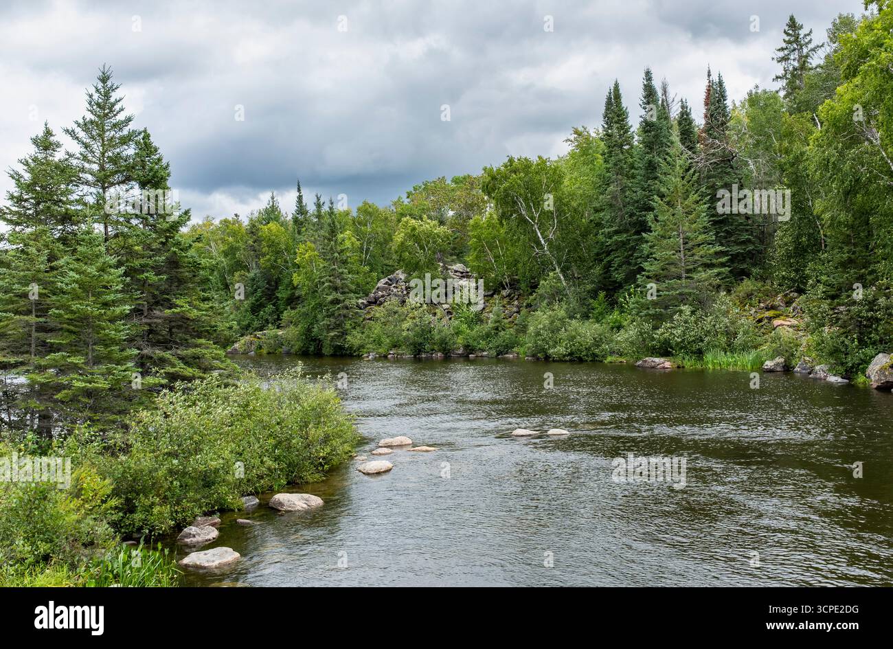 A calm section of the Pinawa channel flows through dense Whiteshell ...