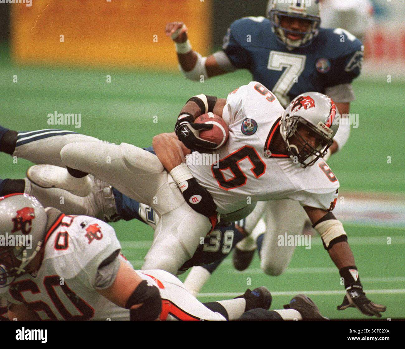 Grey Cup - BC Lions Cory Philpot is taken down by Baltimore 's Matt ...