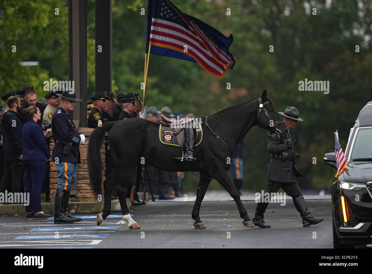 A riderless horse walks during funeral services for slain Northern York County Regional Police ...