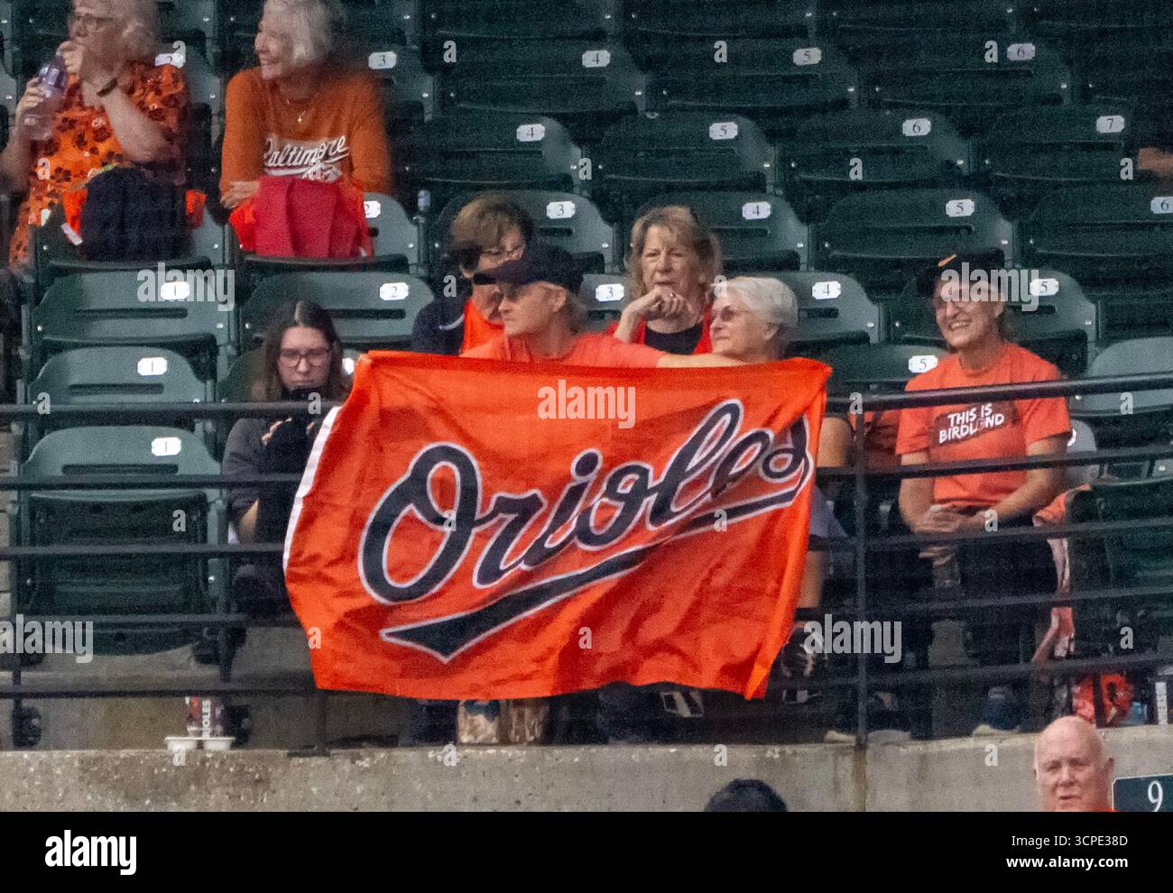 BALTIMORE, MD - SEPTEMBER 25: Orioles fans show their colors during a ...