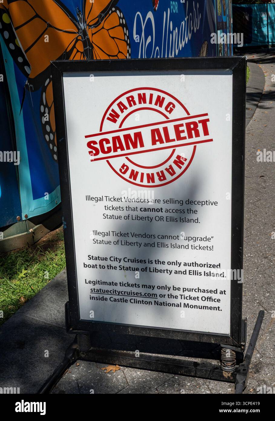 Battery Park features scam alert signs on the sidewalks to assist ...
