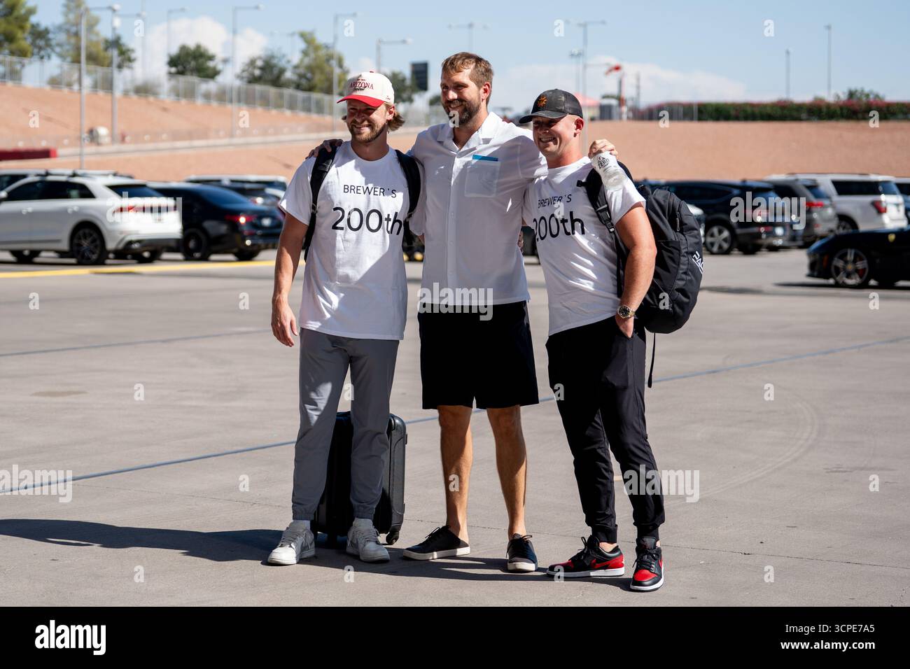 Arizona Cardinals long snapper Aaron Brewer (center) arrives to State ...