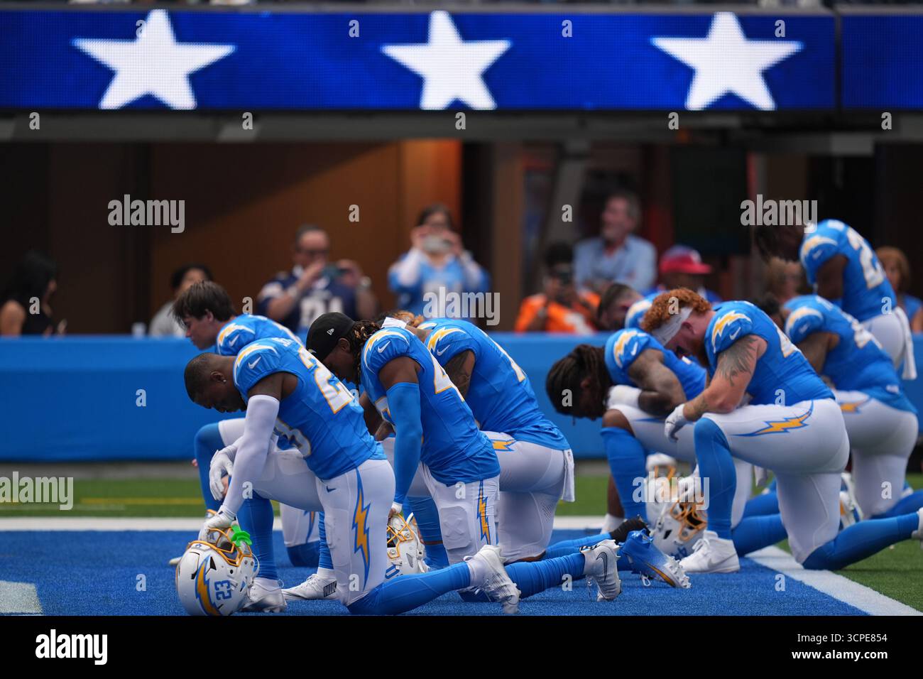Members of the Los Angeles Chargers prayer before of an NFL football ...