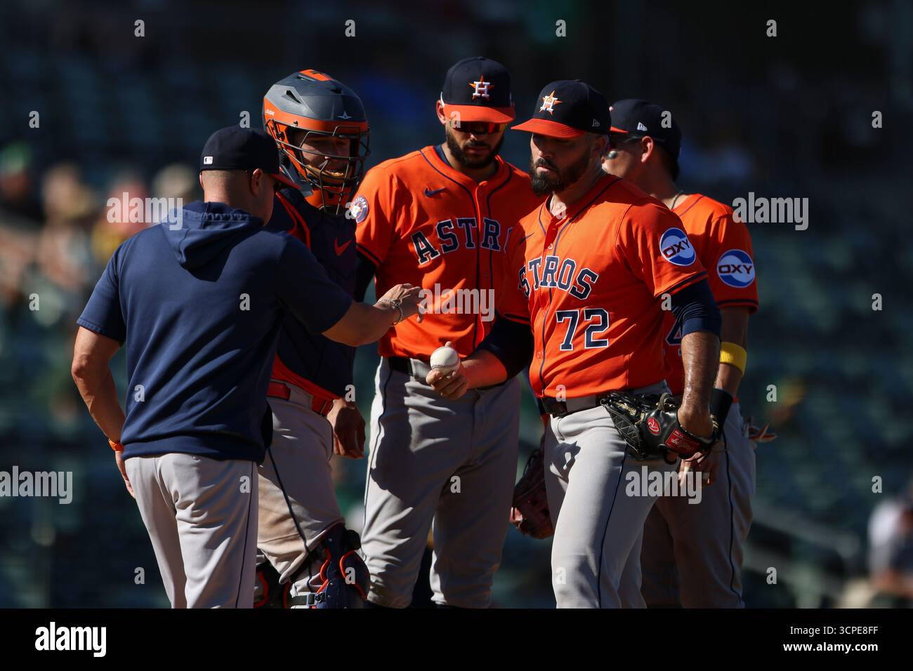 Houston Astros pitcher Nick Hernandez (72) hands the ball to manager ...
