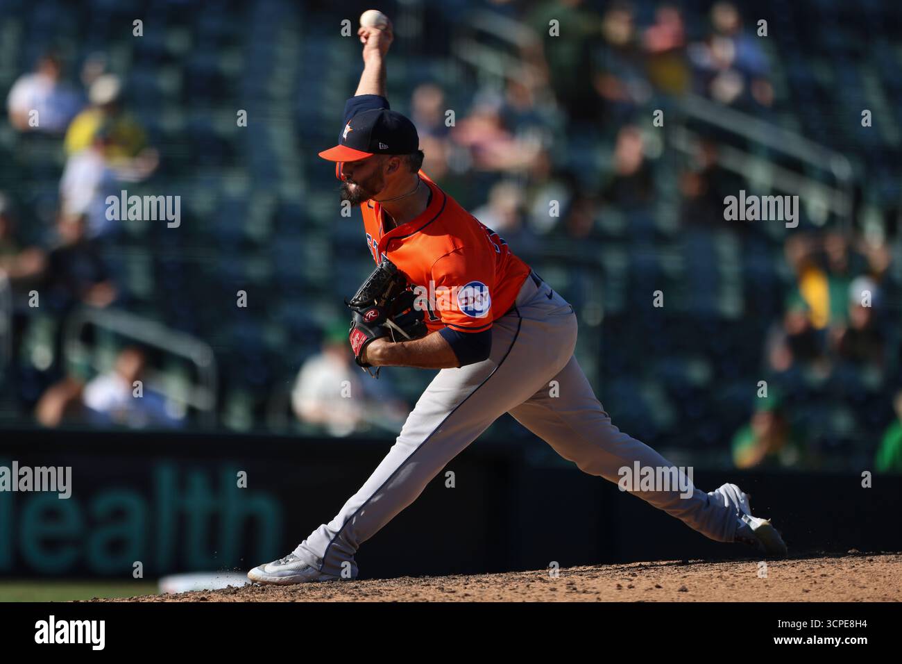 Houston Astros pitcher Nick Hernandez throws to an Athletics batter ...