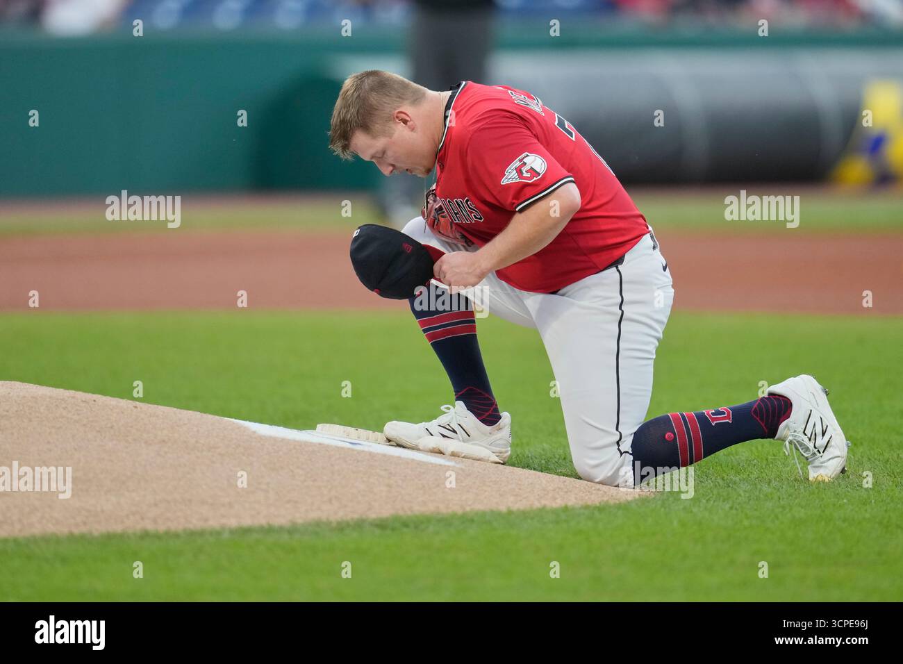 Cleveland Guardians starting pitcher Parker Messick kneels behind the ...