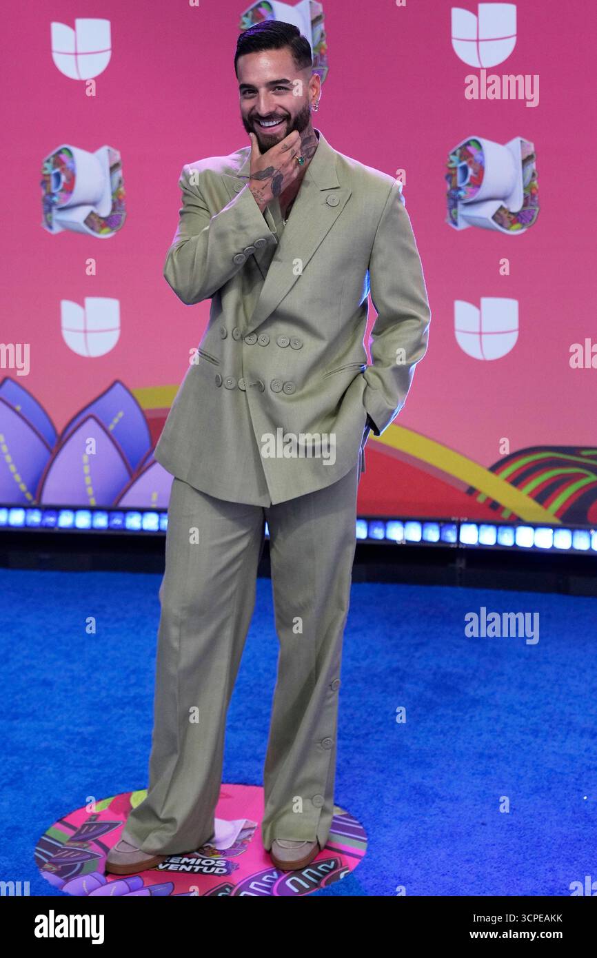 Maluma poses for photos on the red carpet before the start of the ...