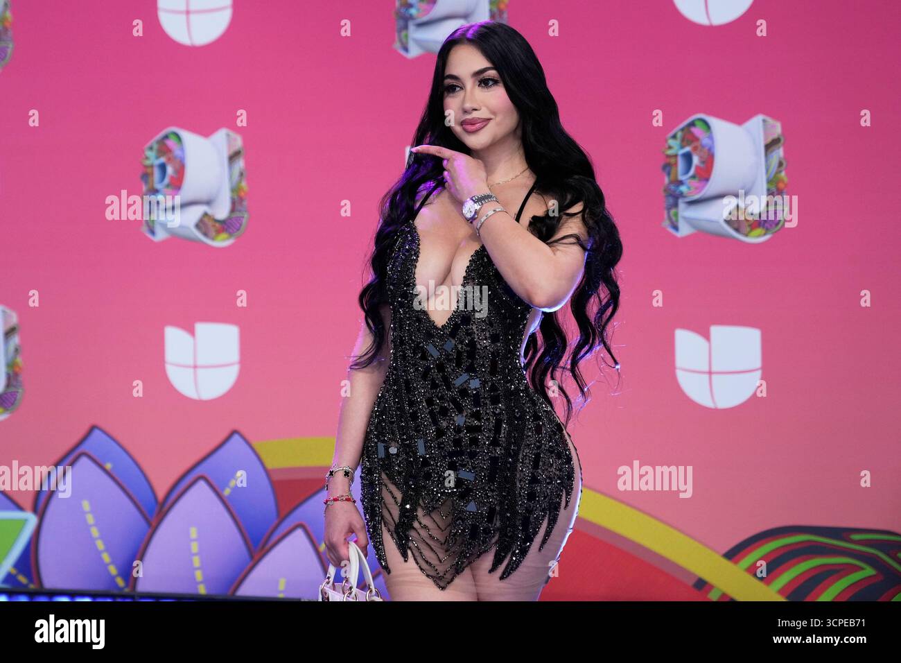 Yailin la Mas Viral poses for photos on the red carpet before the start ...