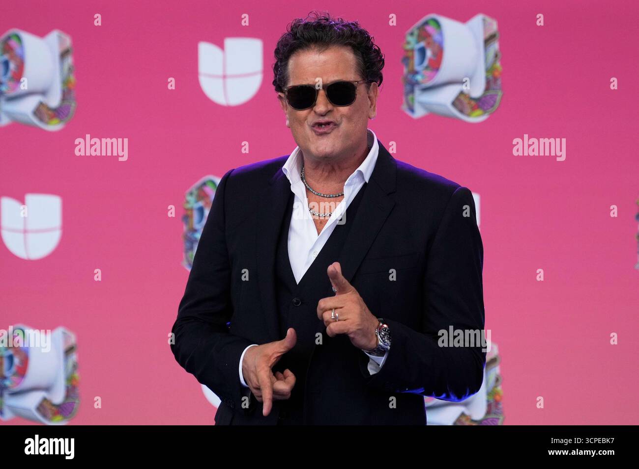 Carlos Vives poses for photos on the red carpet before the start of the ...